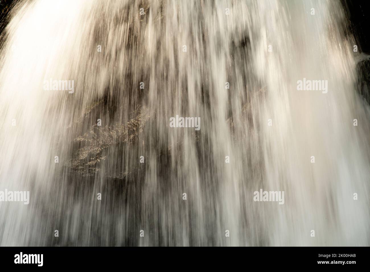Waterfall in a mighty river in the woodland, mountain. Rocks, cliffs ...
