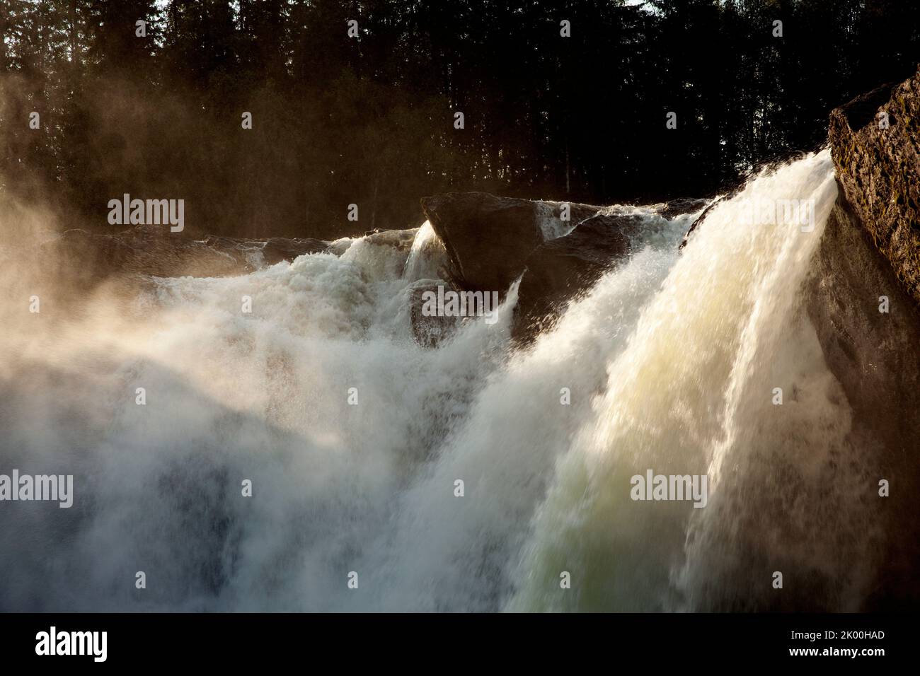 Waterfall in a mighty river in the woodland, mountain. Rocks, cliffs ...