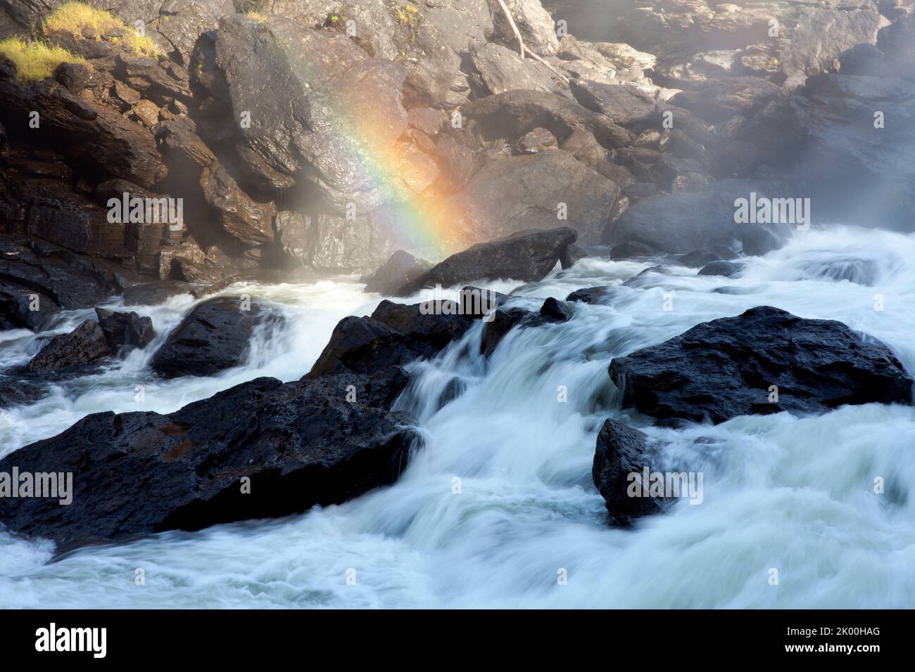 Waterfall in a mighty river in the woodland, mountain. Rocks, cliffs ...