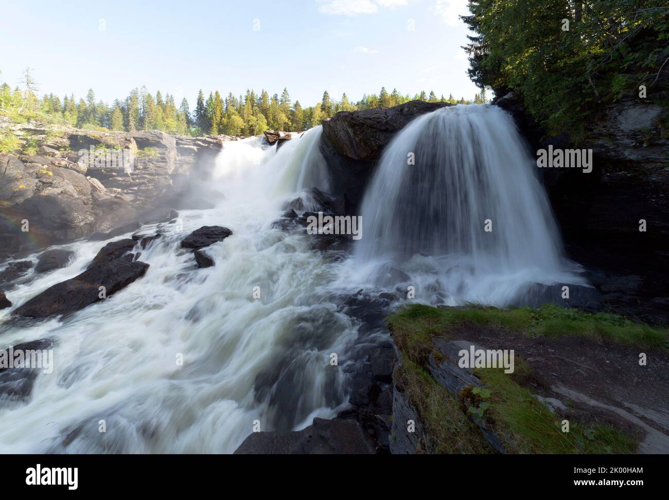 Waterfall in a mighty river in the woodland, mountain. Rocks, cliffs ...