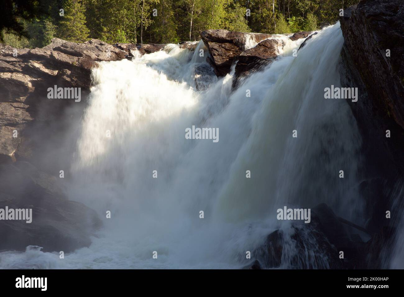 Waterfall in a mighty river in the woodland, mountain. Rocks, cliffs ...