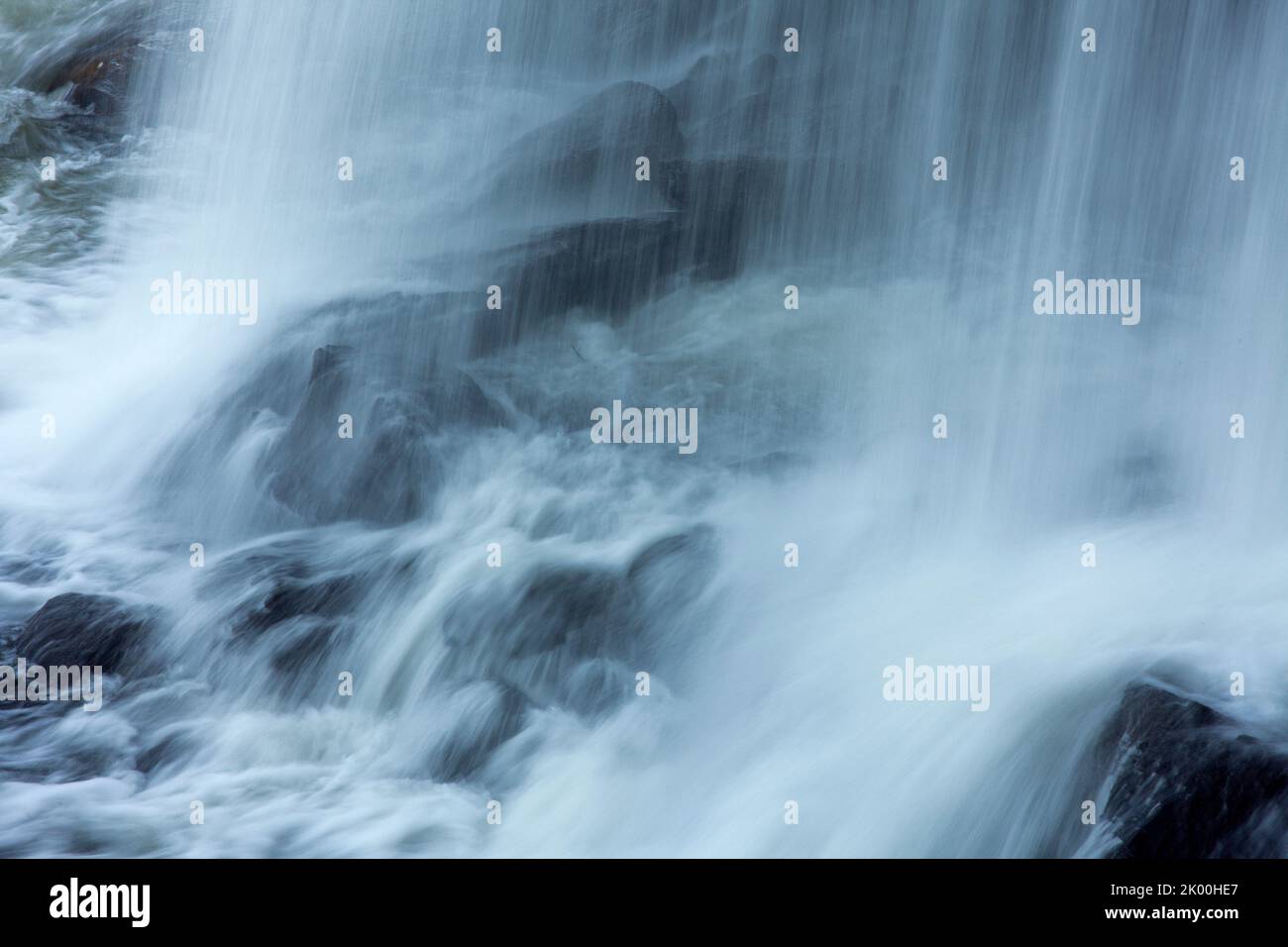 Waterfall in a mighty river in the woodland, mountain. Rocks, cliffs ...