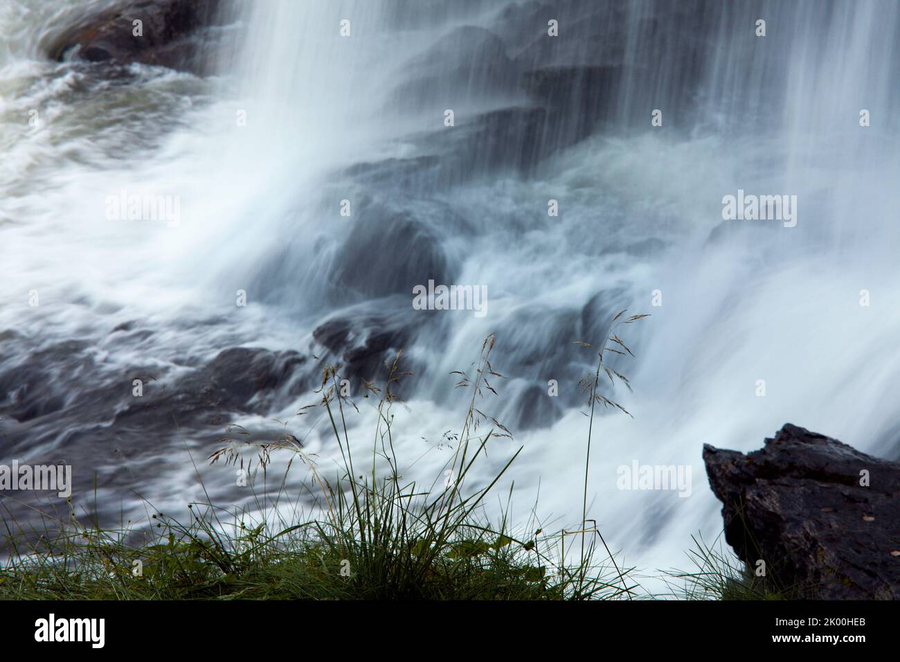 Waterfall in a mighty river in the woodland, mountain. Rocks, cliffs ...
