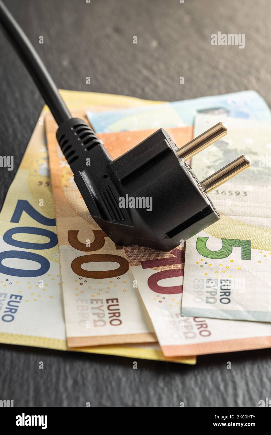 Electric plug and the euro money. Concept of increasing electric prices ...