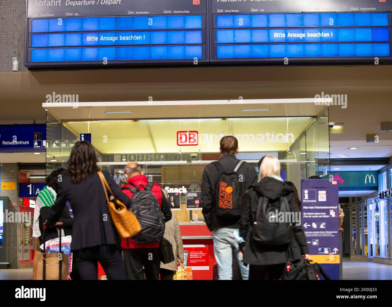 Cologne, Germany. 09th Sep, 2022. Travelers wait in front of a display ...