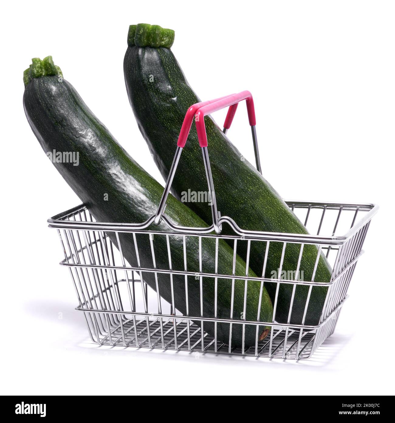green natural organic zucchini vegetable in shopping basket isolated on ...