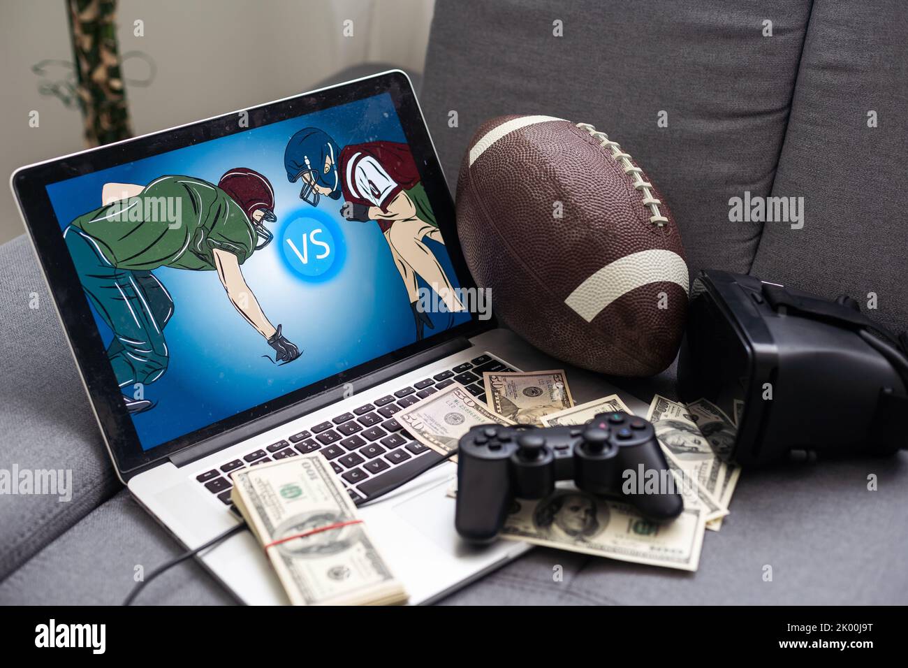 American football ball and joystick. video game Stock Photo - Alamy