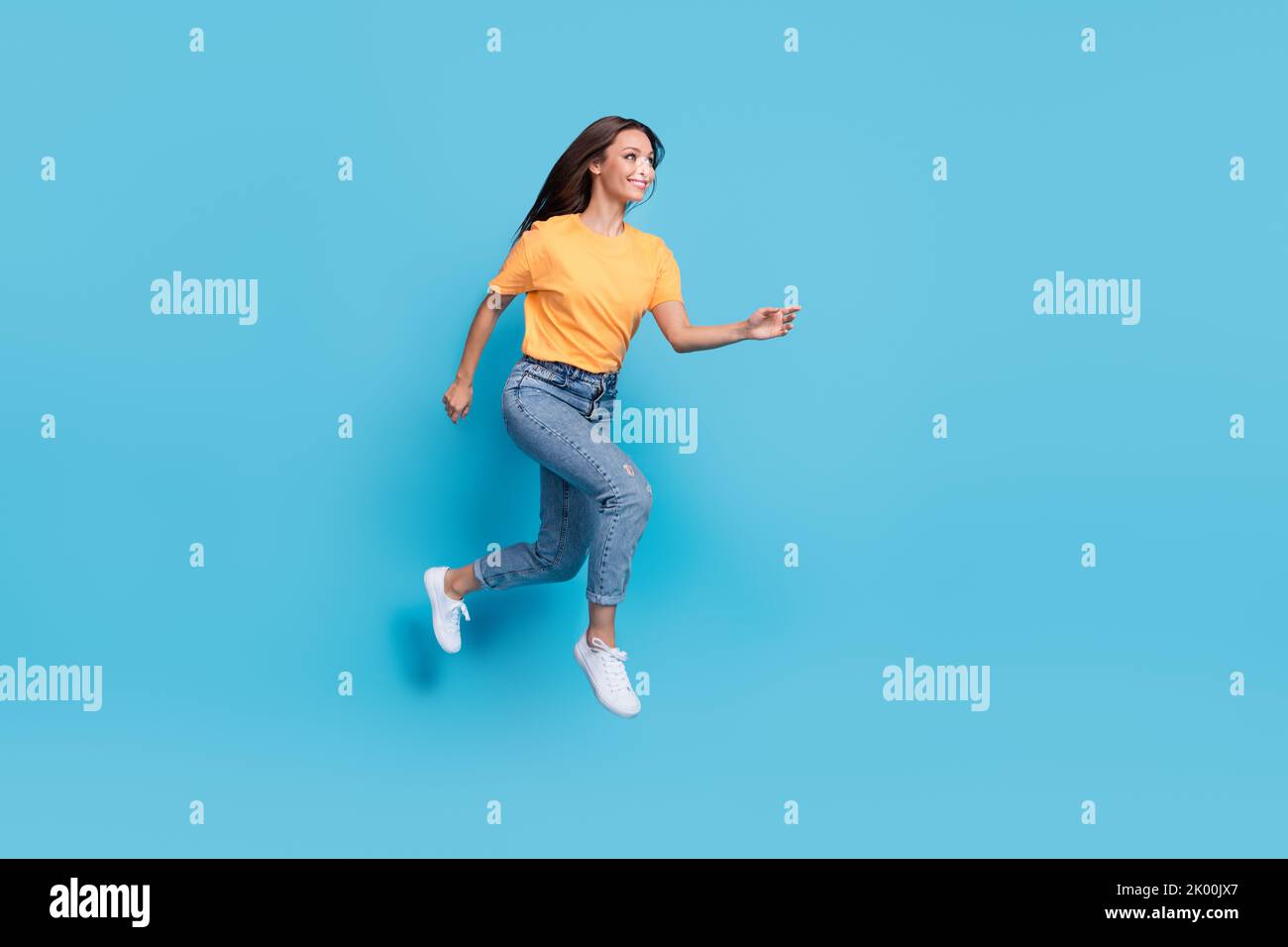 Full length photo of shiny sweet girl dressed yellow t-shirt jumping ...