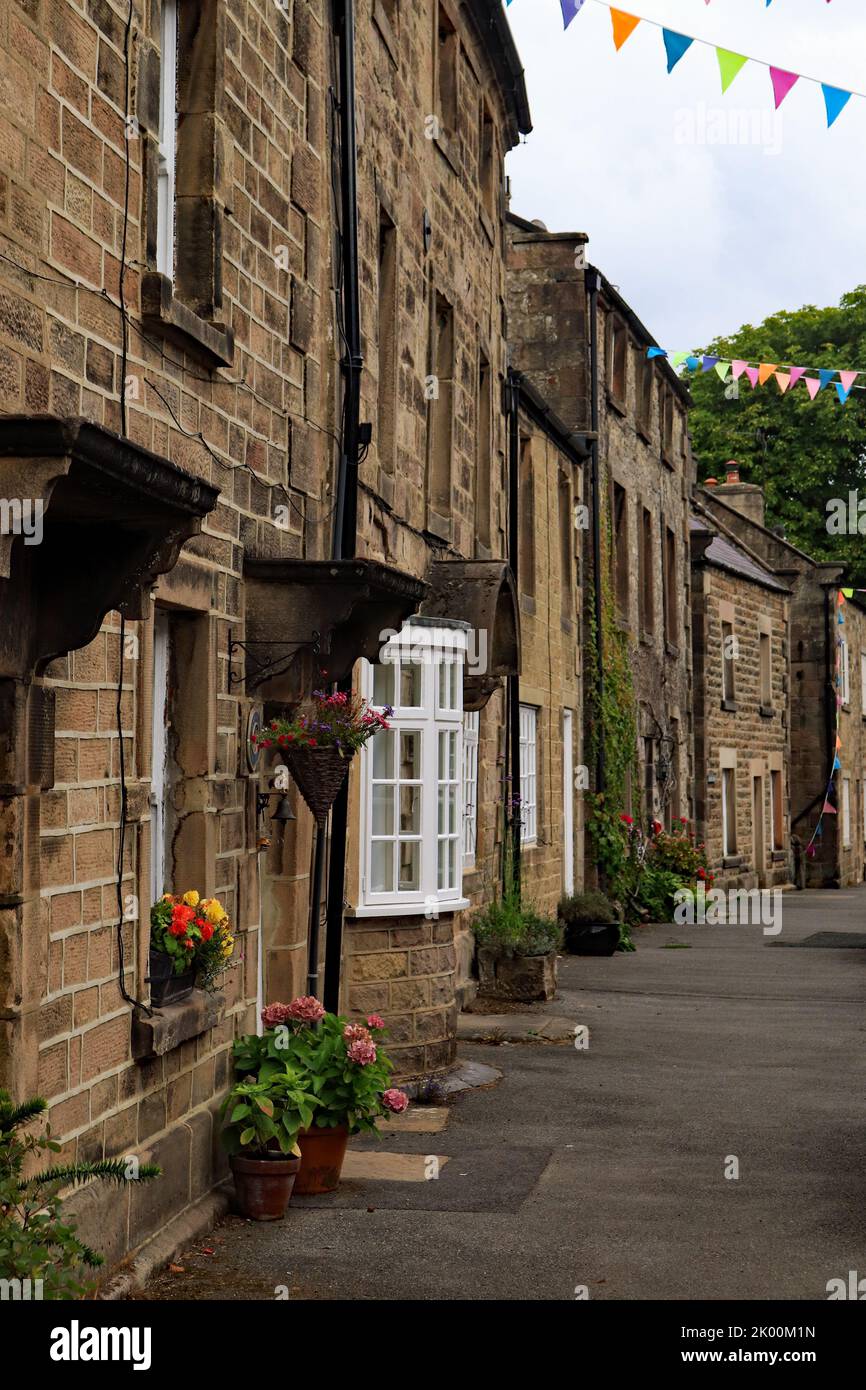 Two and three storey stone cottages homes on Main Street in Winster ...