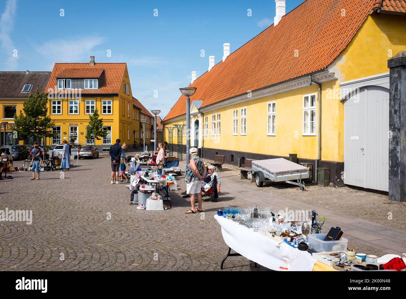 People hold a garage sale in the Historic Merchants Yard in the town ...