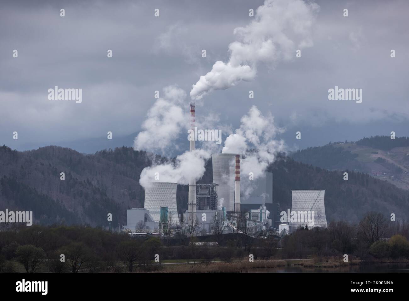 Industrial area, a coal fired power plant with chimneys and cooling ...