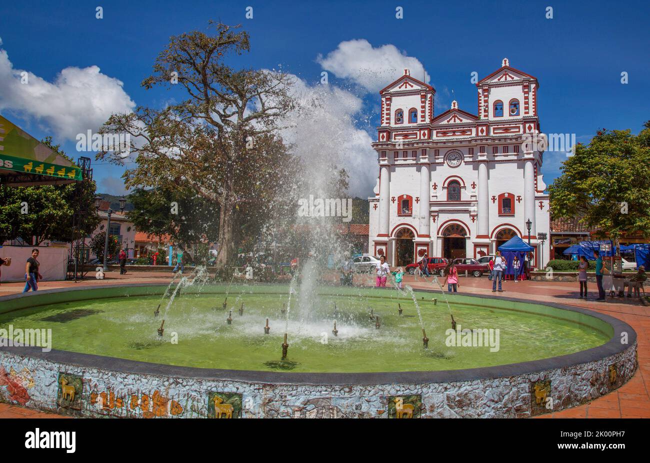 Colombia, Guatape, central square in the village with the church and ...