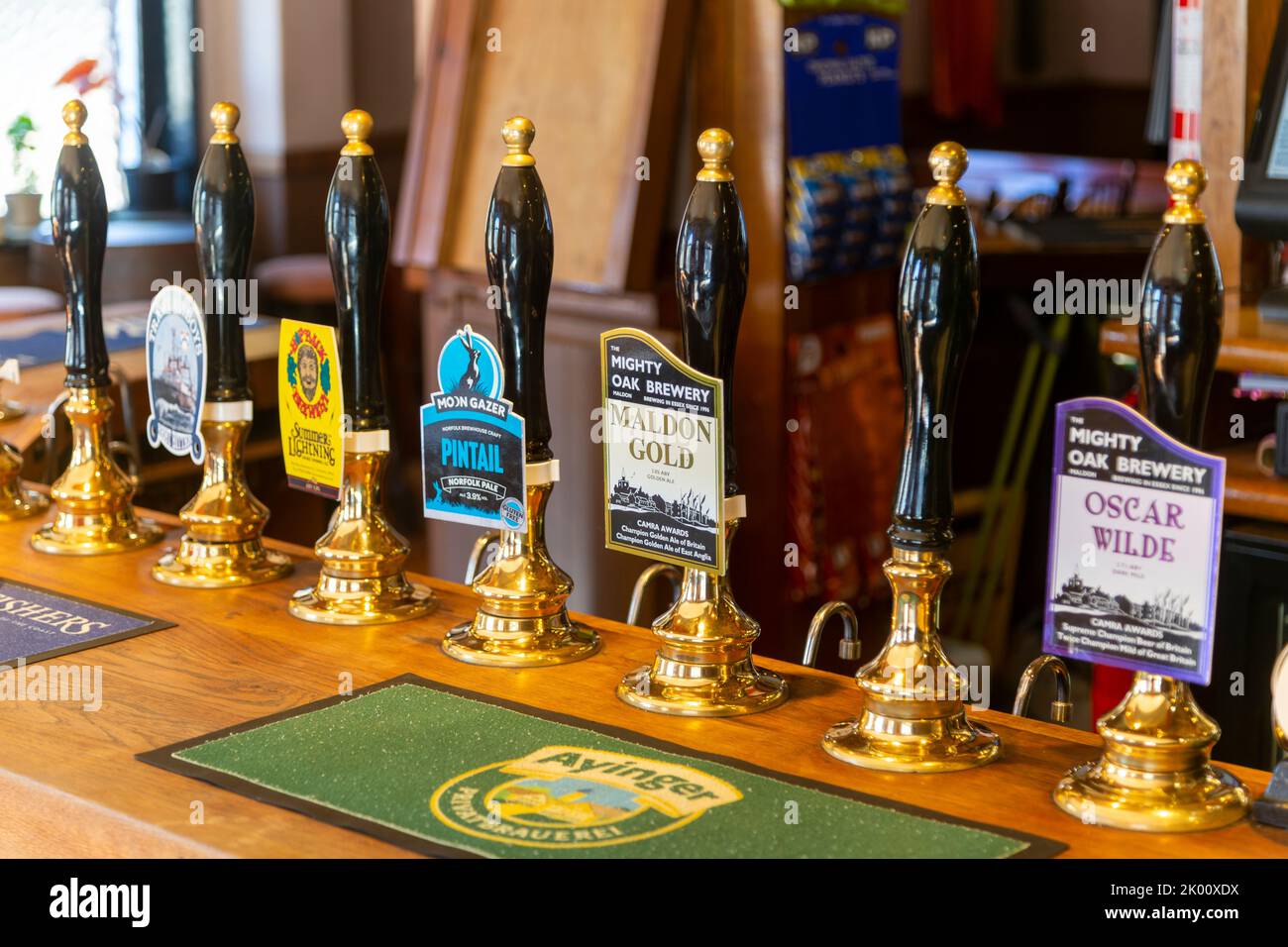 Line of cask beers real ales on bar at Stanford Arms pub, Lowestoft ...