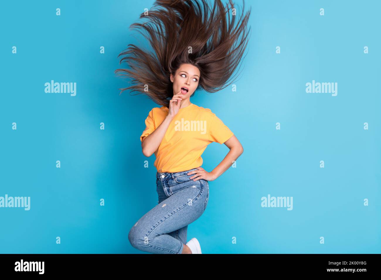 Photo of shiny impressed girl dressed yellow t-shirt finger chin wind ...