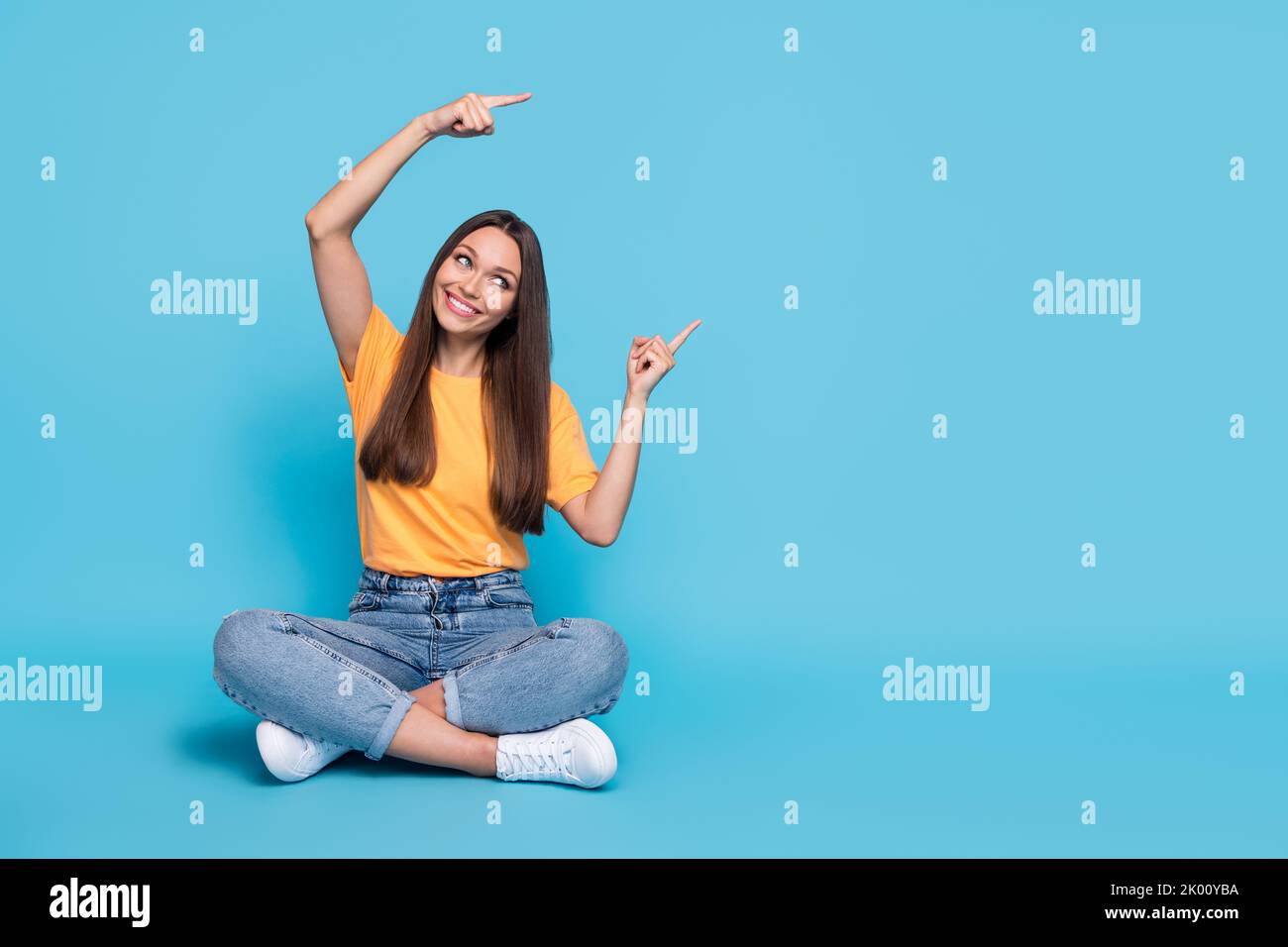 Photo of adorable dreamy girl dressed yellow t-shirt looking pointing ...