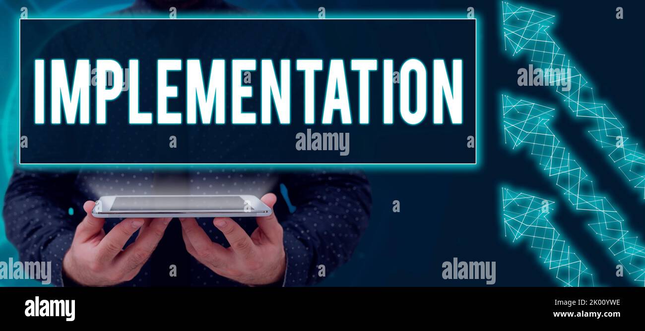 Hand writing sign ImplementationThe process of making something active ...