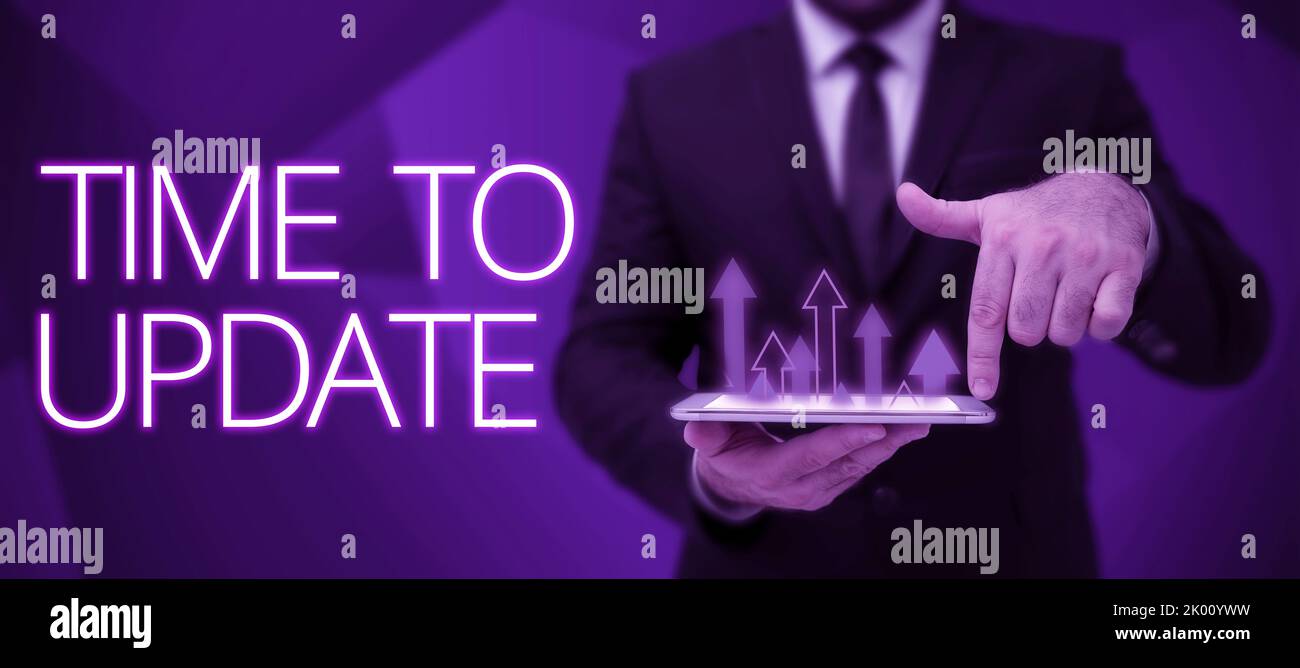Hand writing sign Time To UpdateThe latest information about a ...