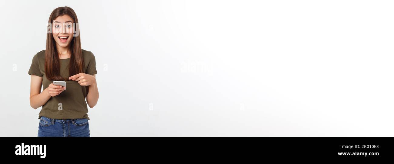 Laughing woman talking and texting on the phone isolated on a white ...