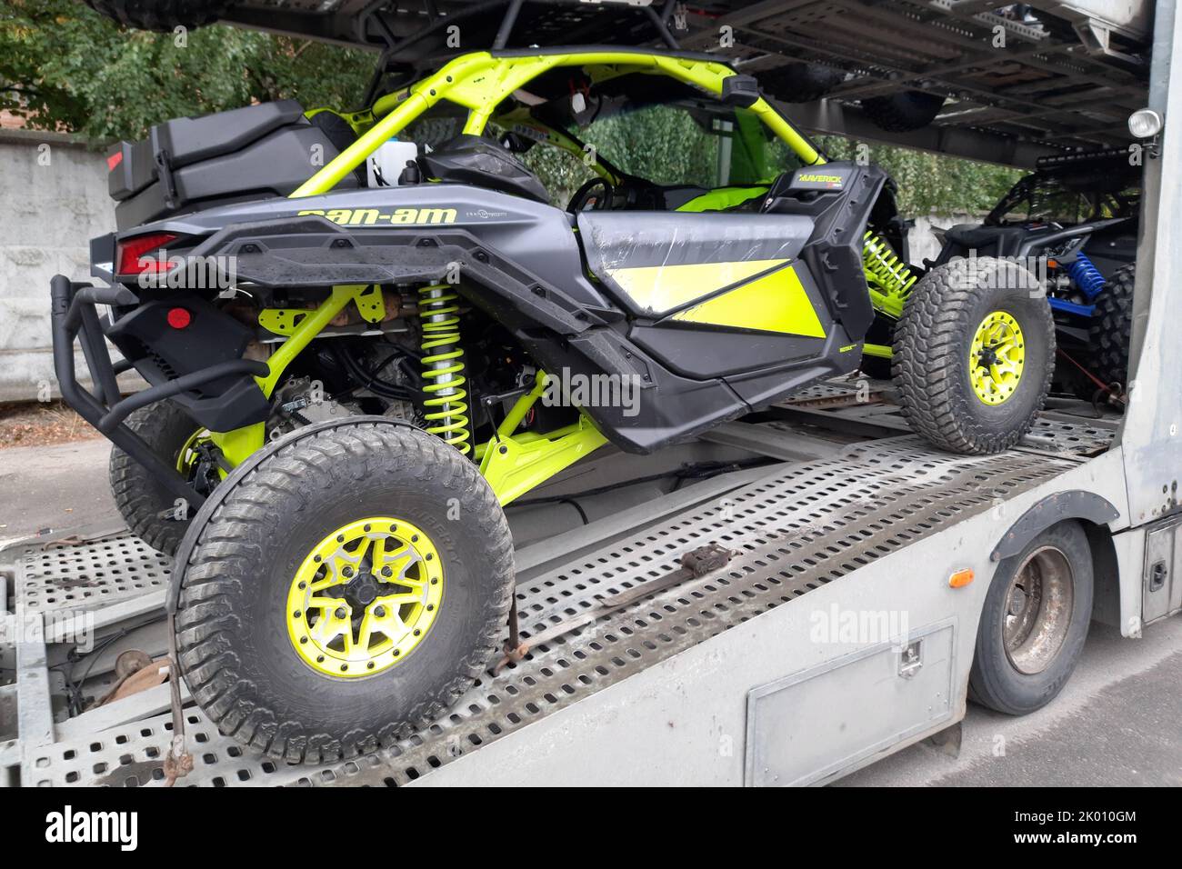 Transportation of a sports car buggy on a car transporter Stock Photo ...