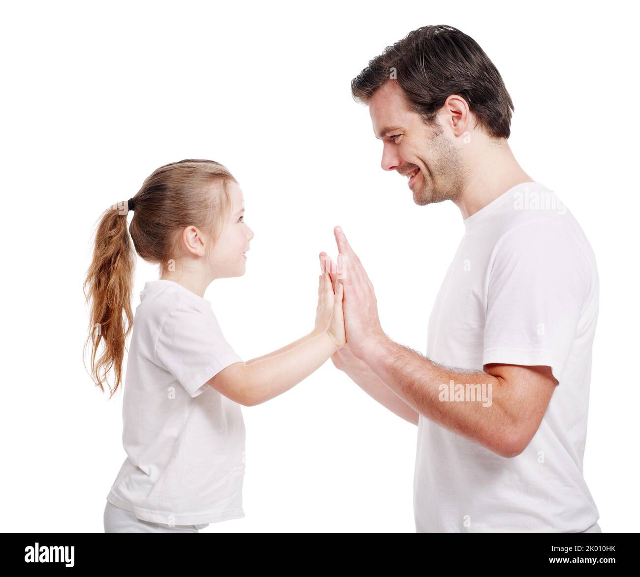 Taking time out to play with his darling. Side view of a young father ...
