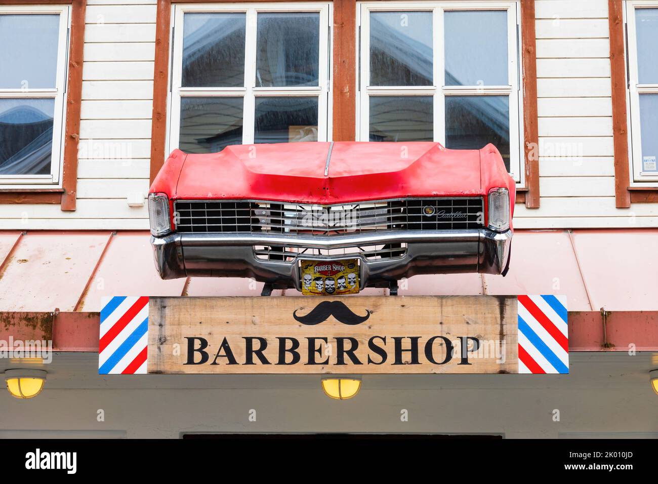 Barbershop with unique front of an old Cadillac car over the entrance ...