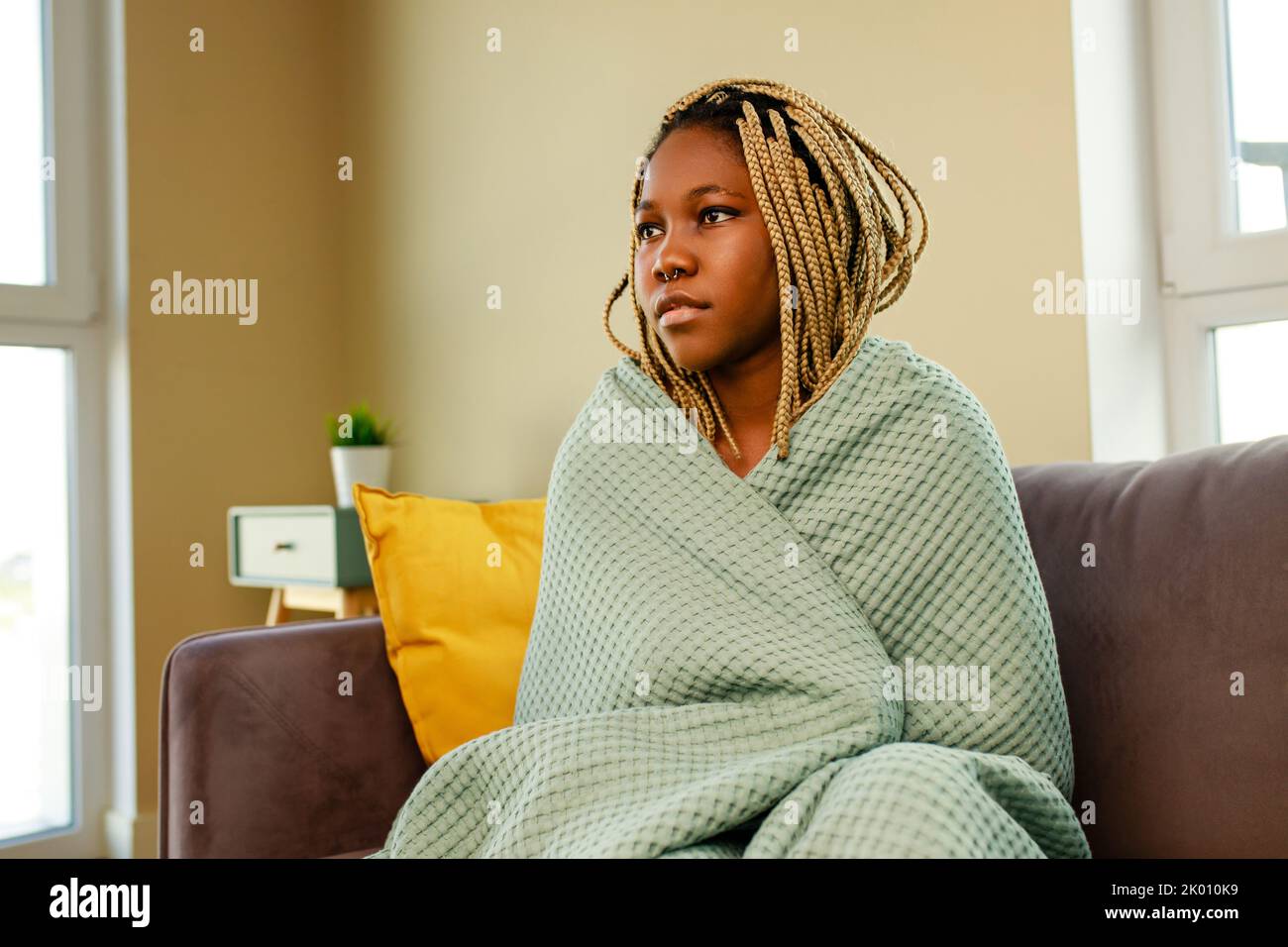Person wrapped in blanket at home hi-res stock photography and images ...