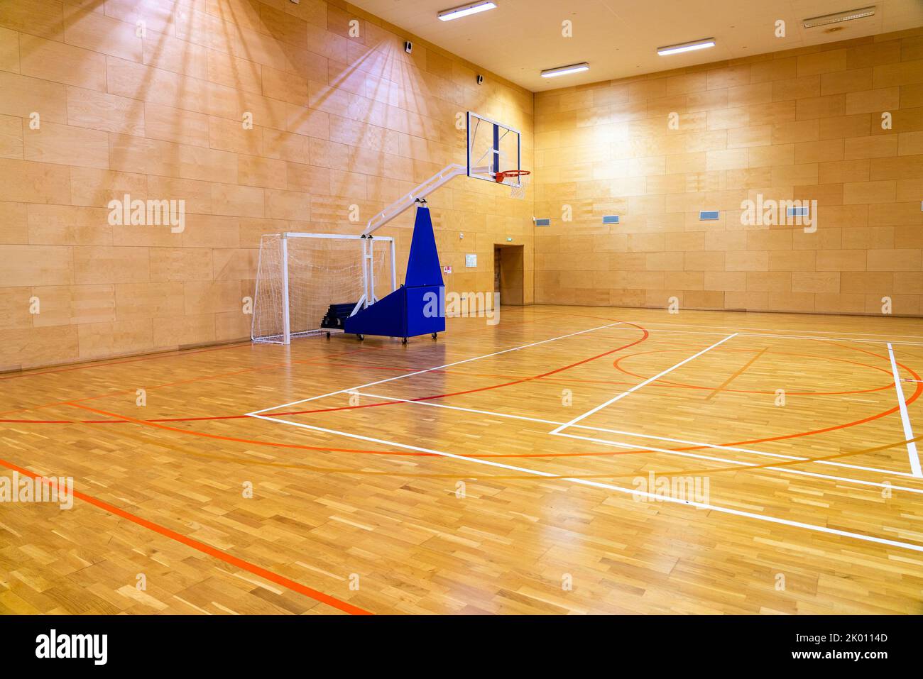 Photo of empty basketball gym with movable basket Stock Photo - Alamy