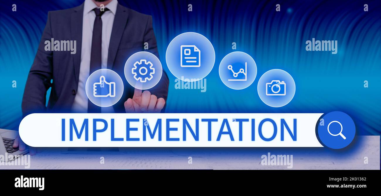 Hand writing sign ImplementationThe process of making something active ...