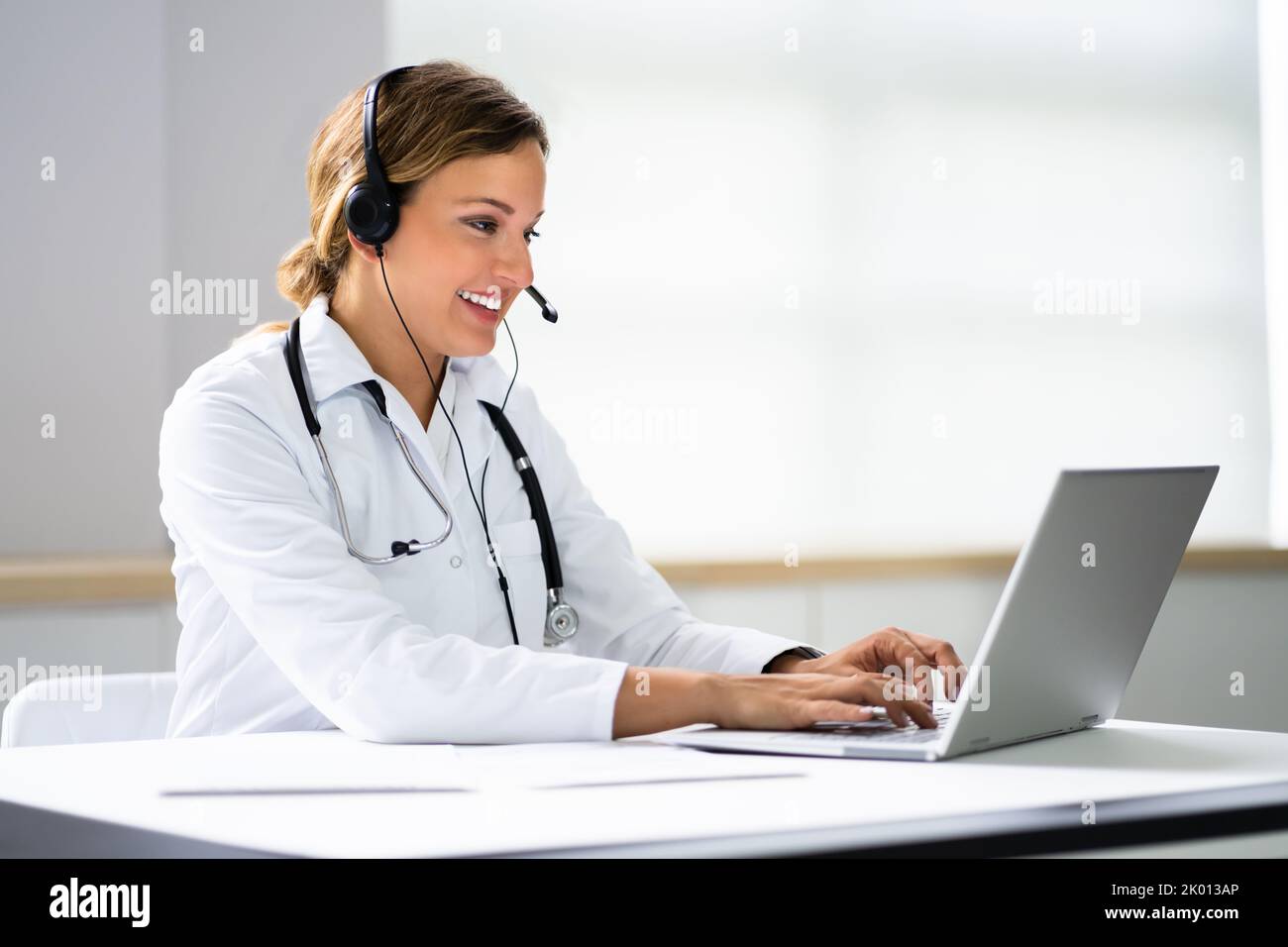Happy Hospital Receptionist With Headset. Doctor Call Conference ...