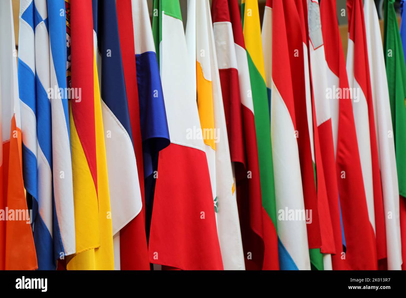background with many international flags of many nations and different ...