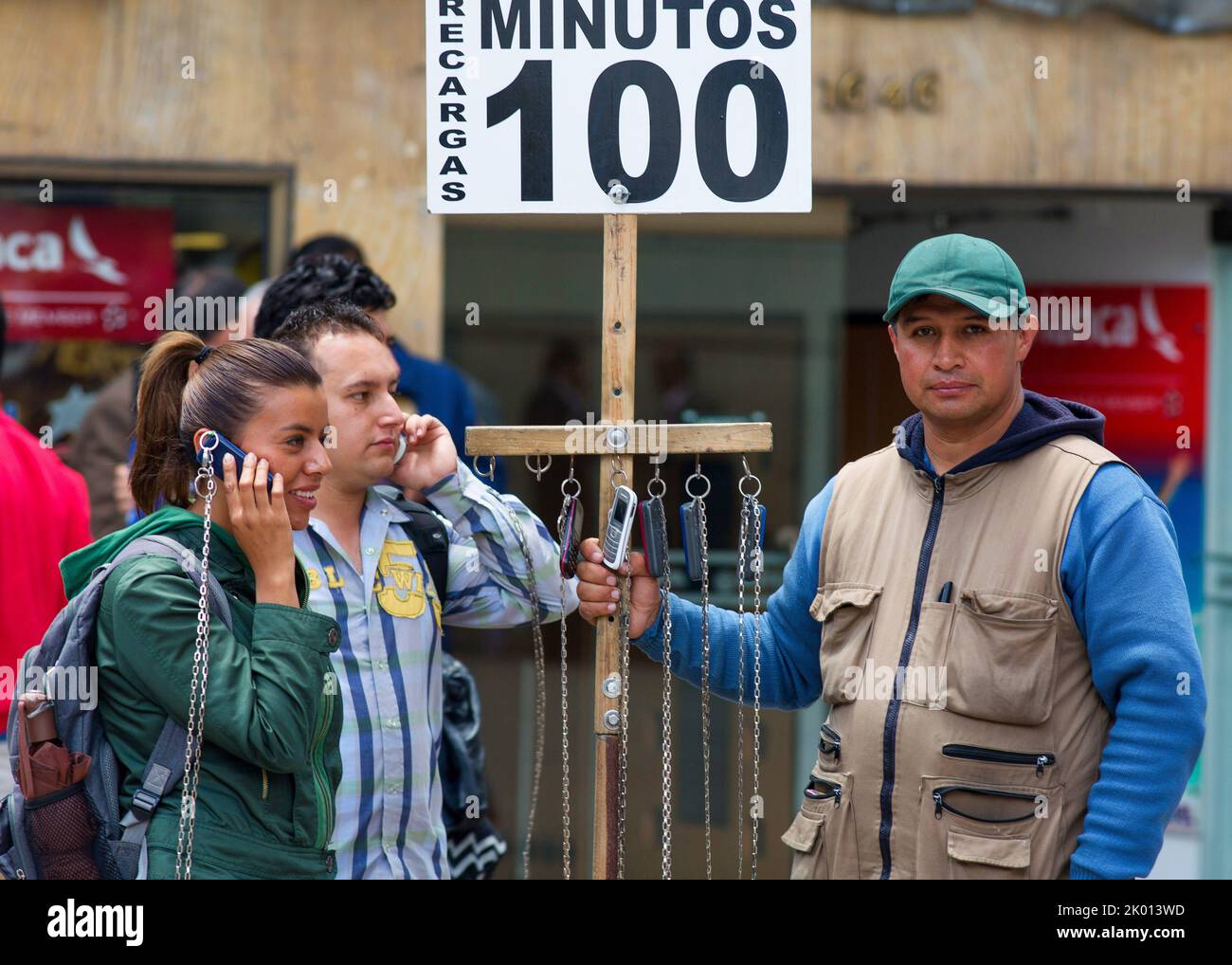 Colombia, Bogota,a man is renting out several mobile phones to passers ...