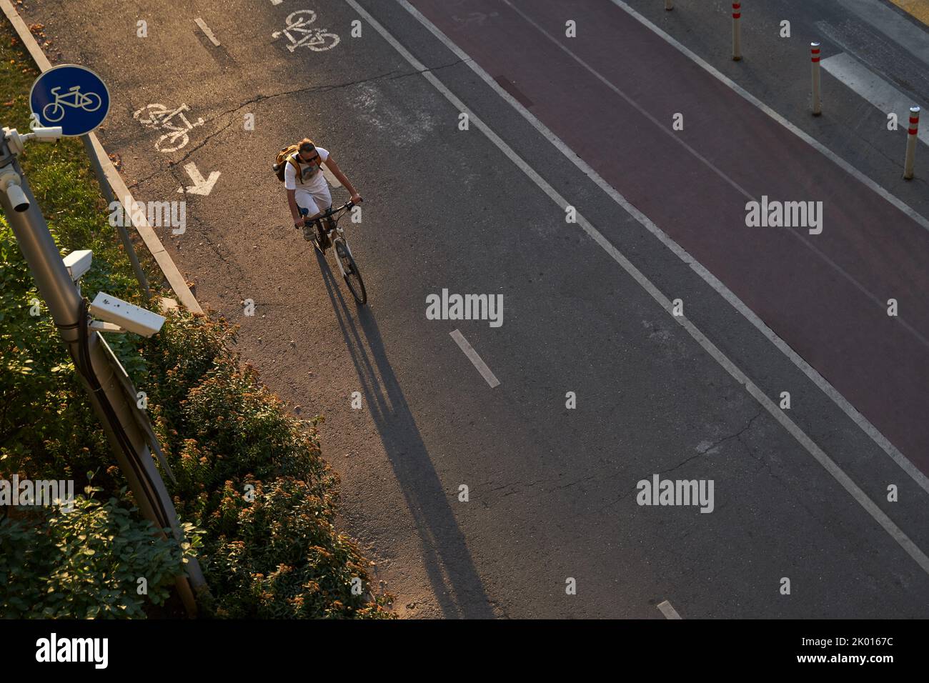 Man bicycling on cycling road. Concept of active lifestyle. Top aerial ...
