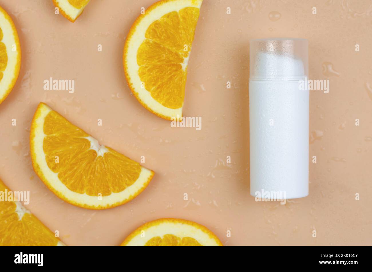 Cosmetics with orange. Orange Moisturizer. Blank white cosmetic tube ...