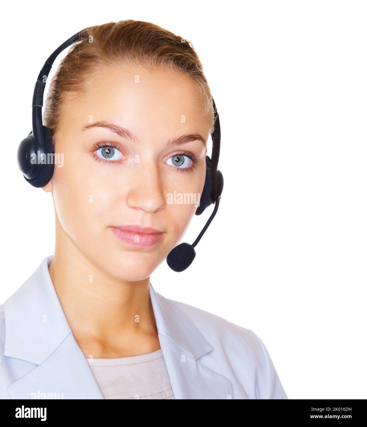 Closeup of a cute female using a headset on white. Closeup portrait of ...