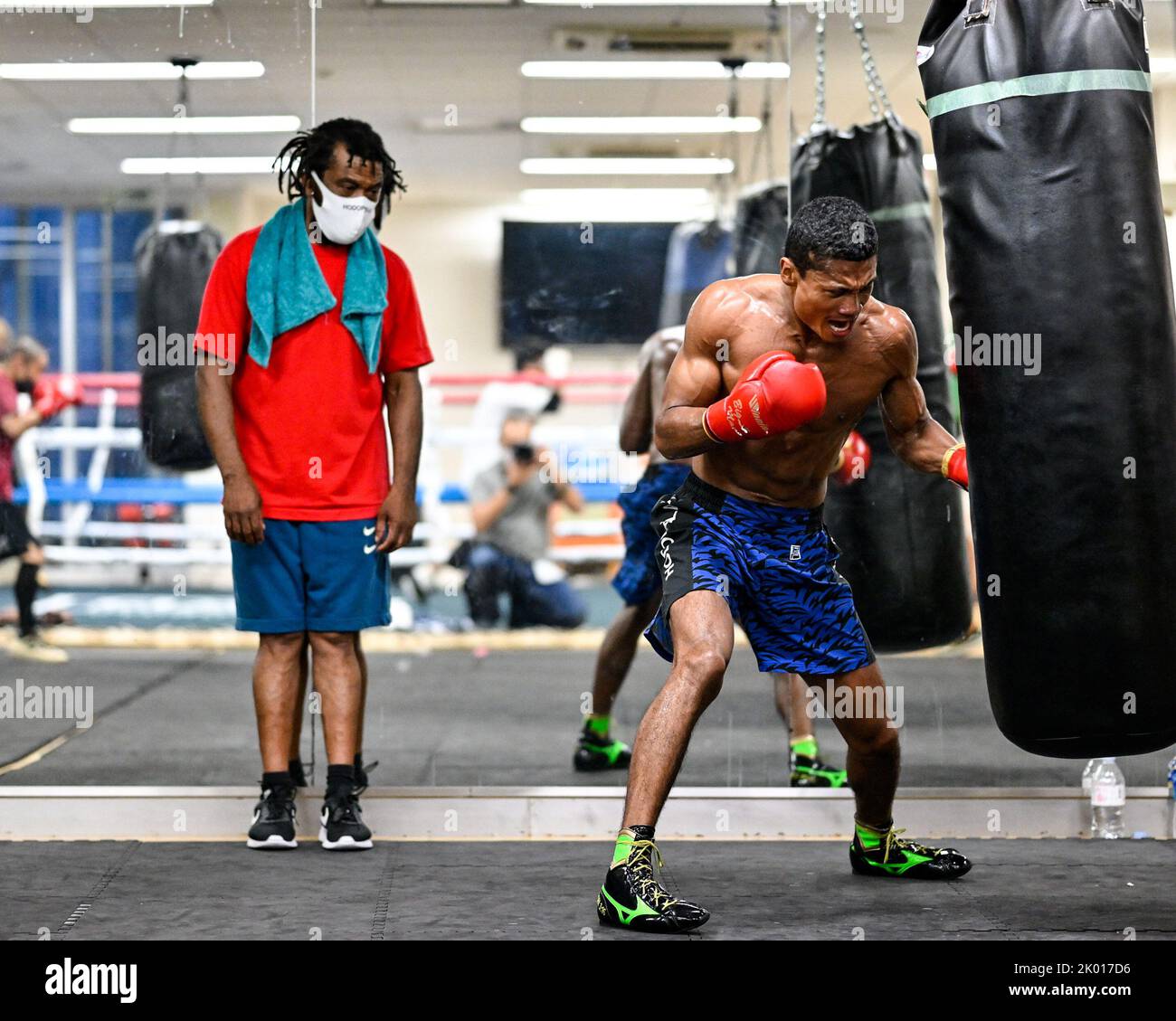Andy Hiraoka (R) of Japan and his his trainer and father Justice Codjoe ...
