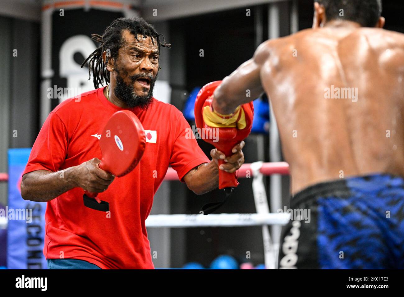 Andy Hiraoka (R) of Japan and his his trainer and father Justice Codjoe ...