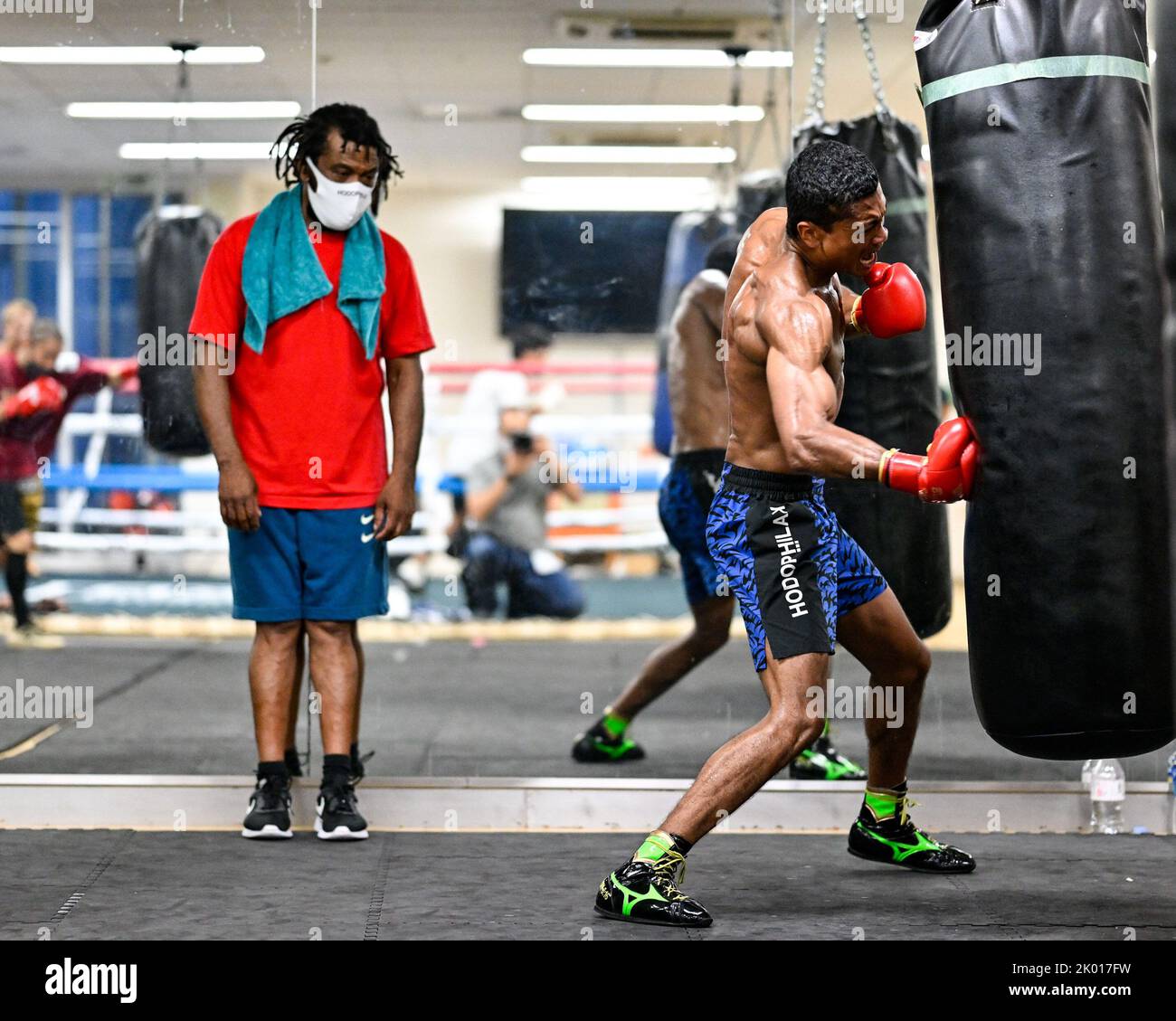 Andy Hiraoka (R) of Japan and his his trainer and father Justice Codjoe ...