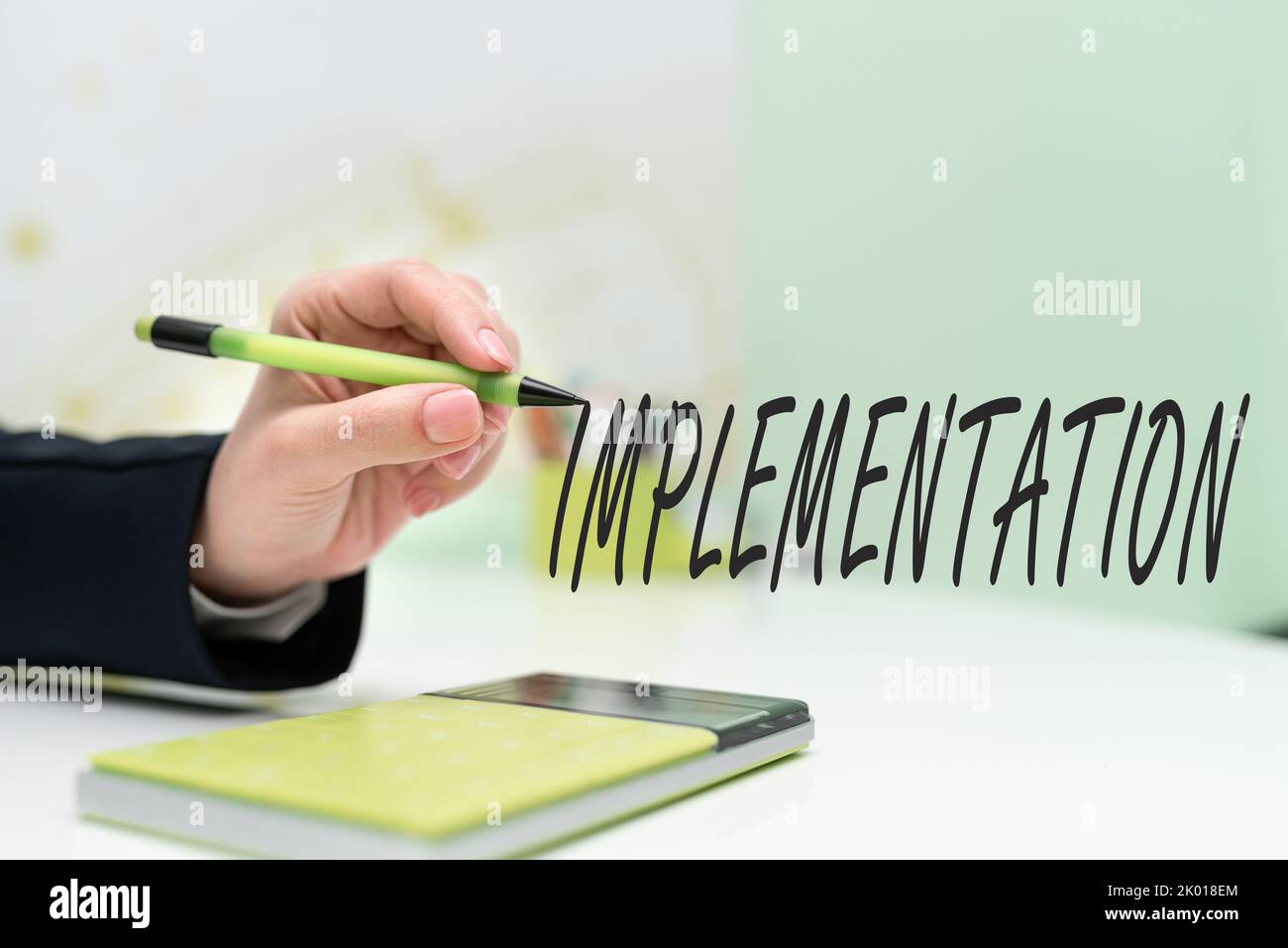 Text caption presenting ImplementationThe process of making something ...