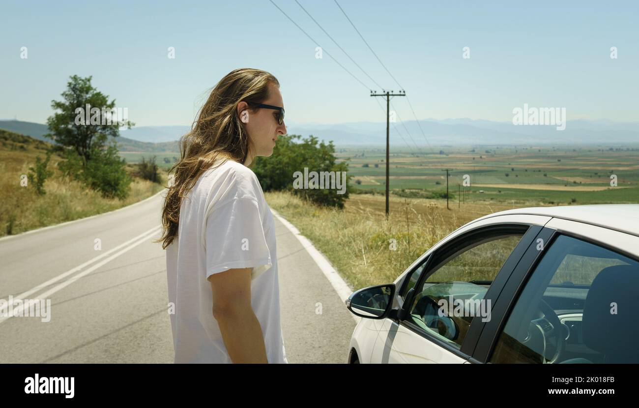 Man stands on road hi-res stock photography and images - Alamy