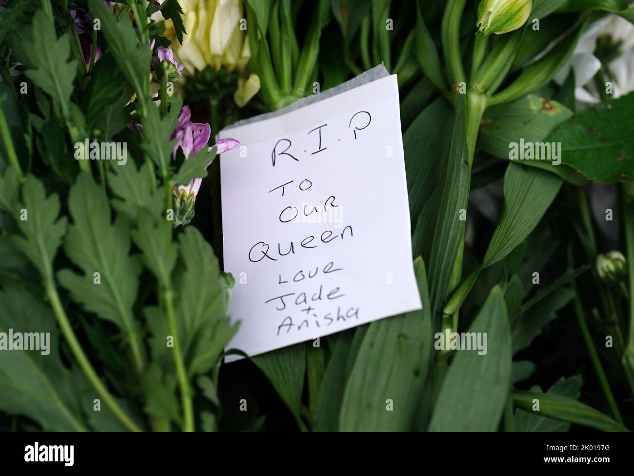 Flowers and messages of condolence are laid outside Nottingham Council ...