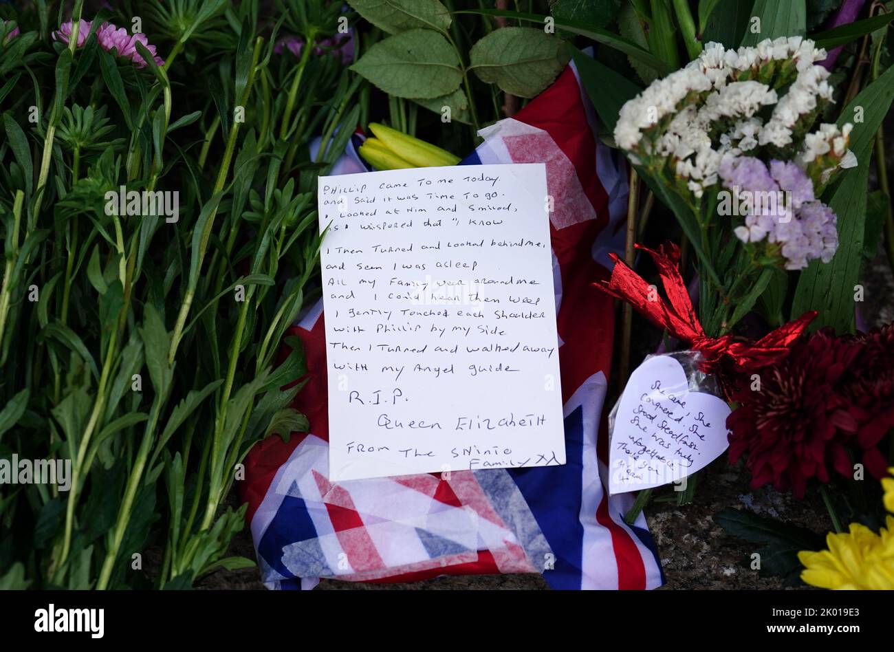 Flowers and messages of condolence are laid outside Nottingham Council ...
