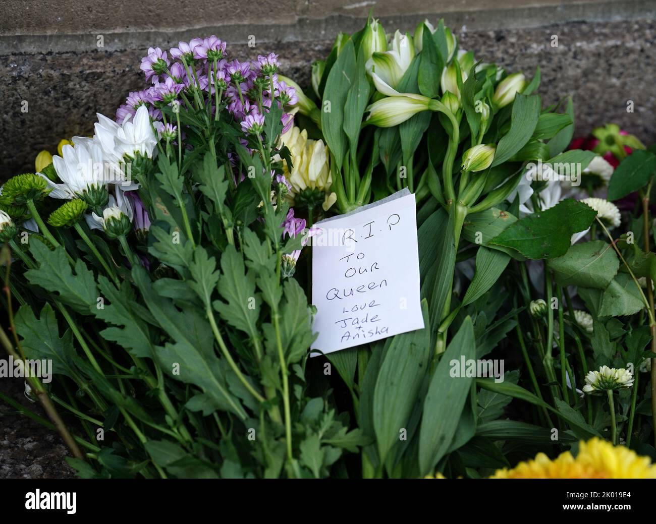 Flowers and messages of condolence are laid outside Nottingham Council ...