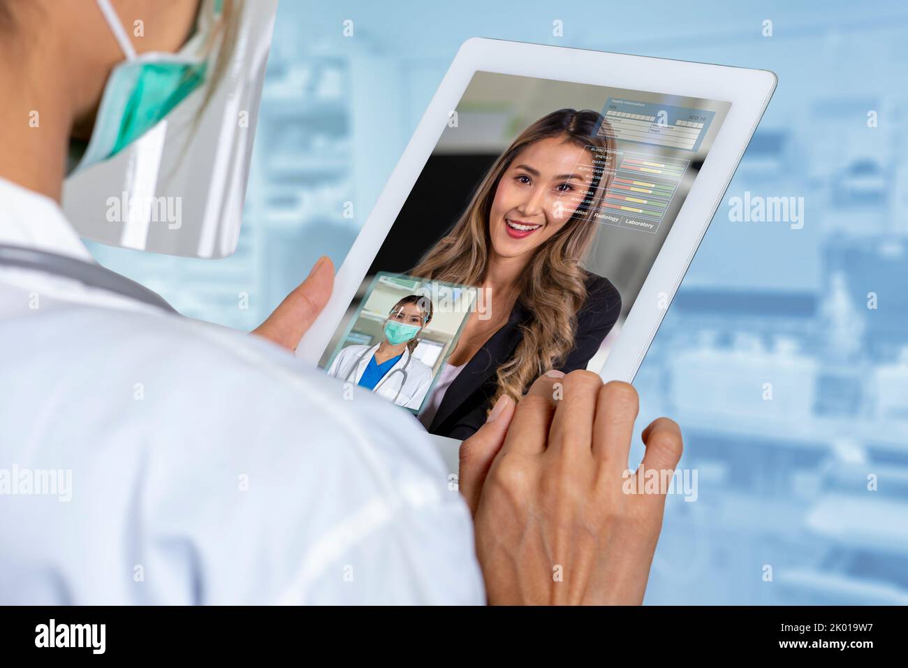 Female doctor uses digital tablet to provide medical consultations with ...