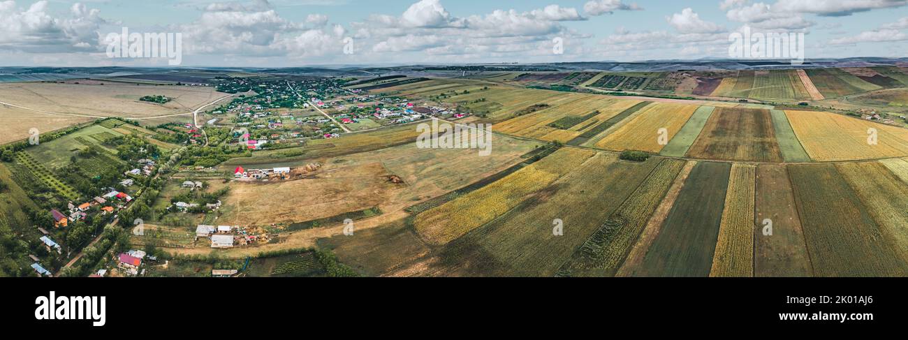Aerial panoramic view of rural village landscape with yellow patched ...