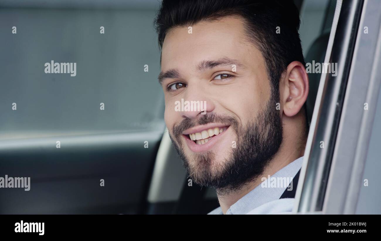 Happy young man driving car hi-res stock photography and images - Alamy