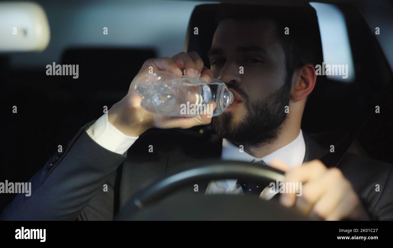 Driver drinking from water bottle hi-res stock photography and images ...