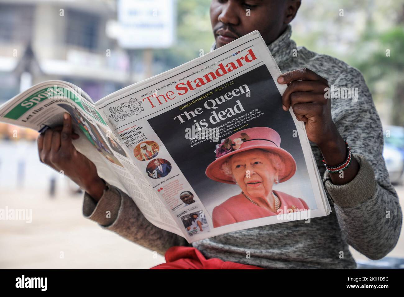 Nairobi, Kenya. 09th Sep, 2022. A newspaper vendor seen reading a local ...