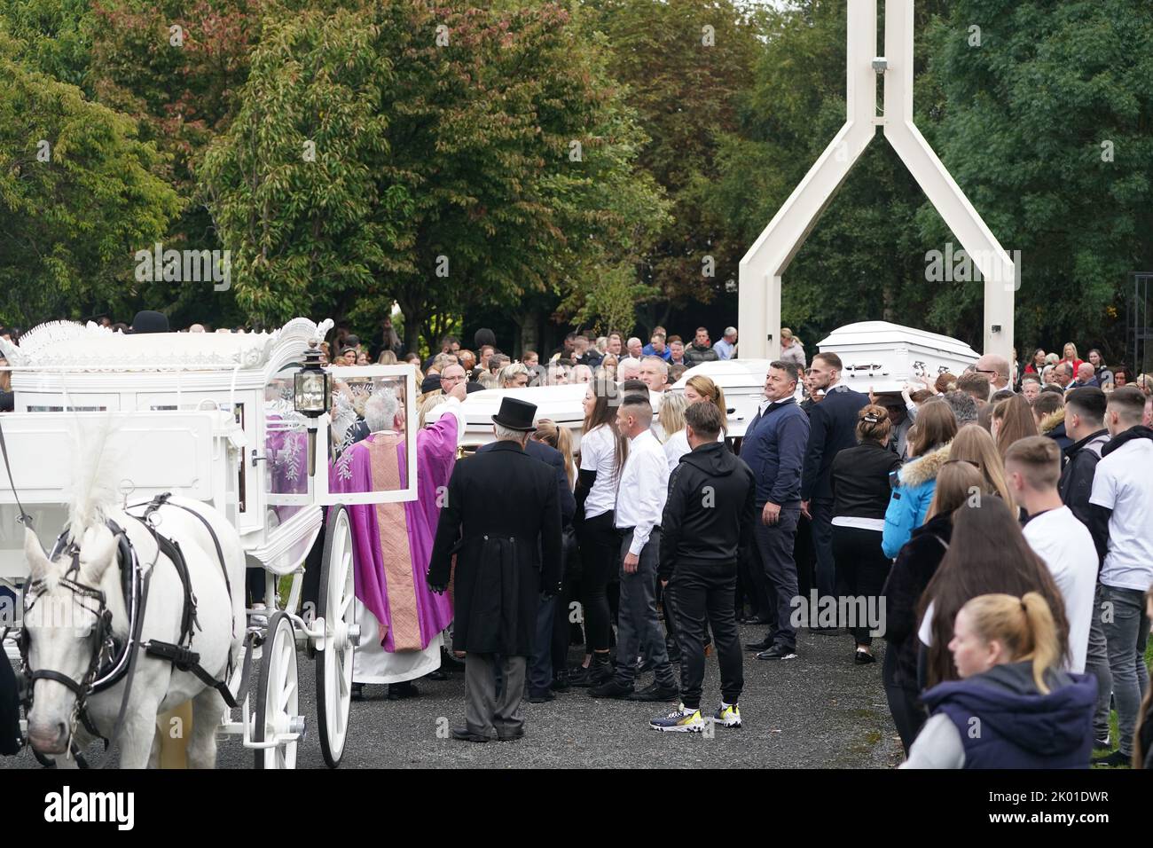 The coffins of Lisa Cash, 18, and her eight-year-old twin siblings ...
