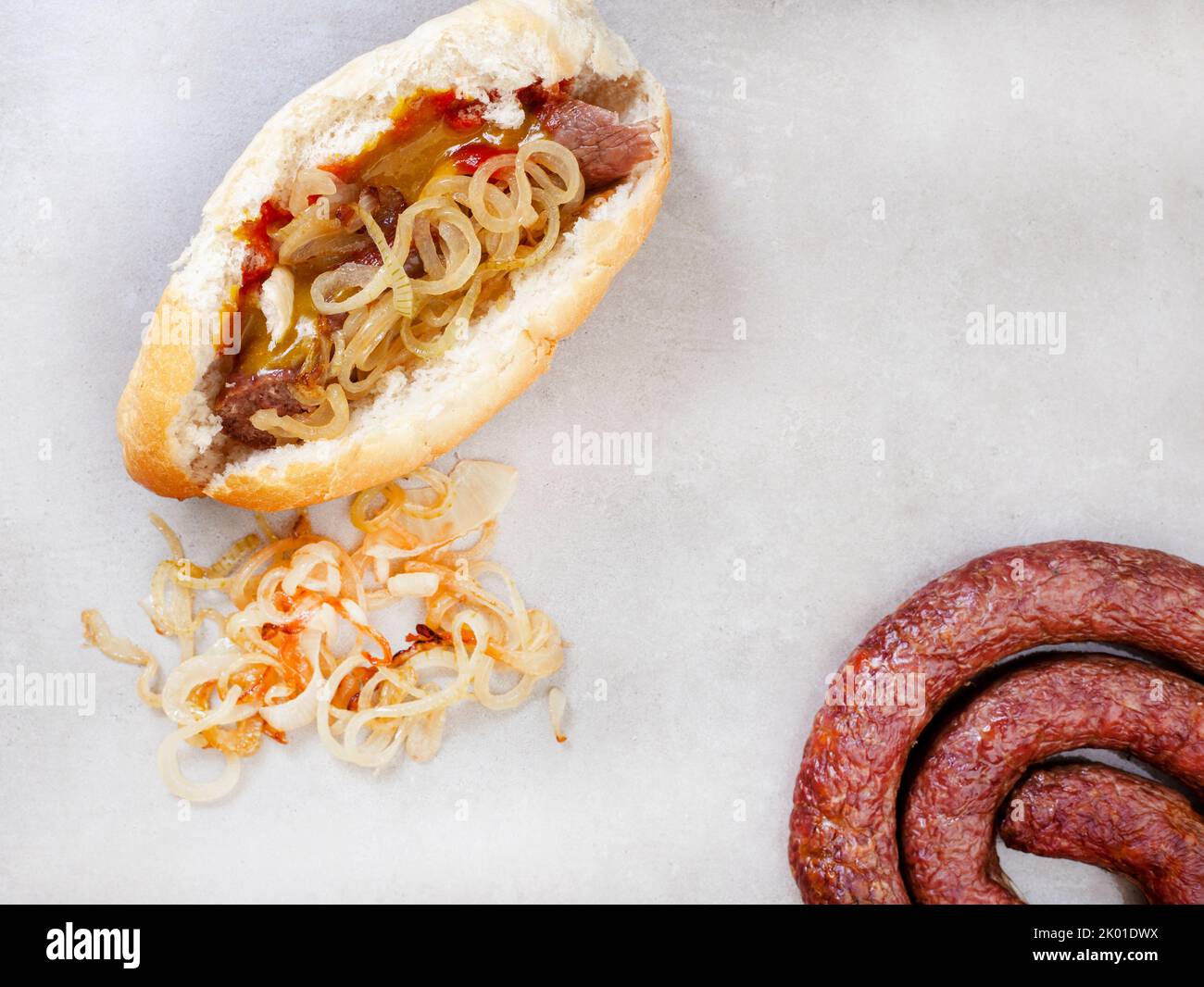 South African famous boerewors roll, flat lay with ingredients and copy ...