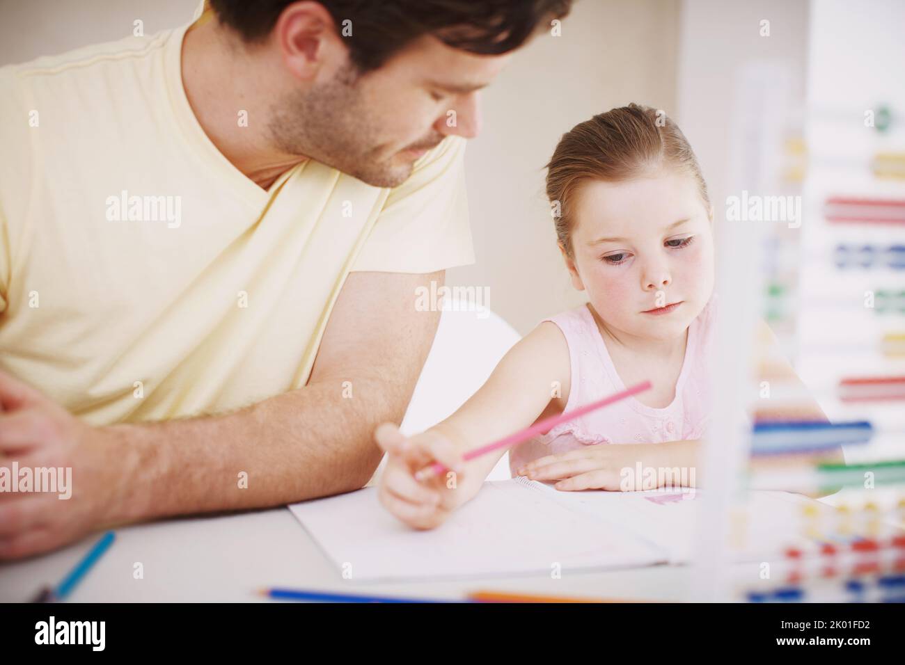 She always does her homework. a little girl doing her homework Stock ...